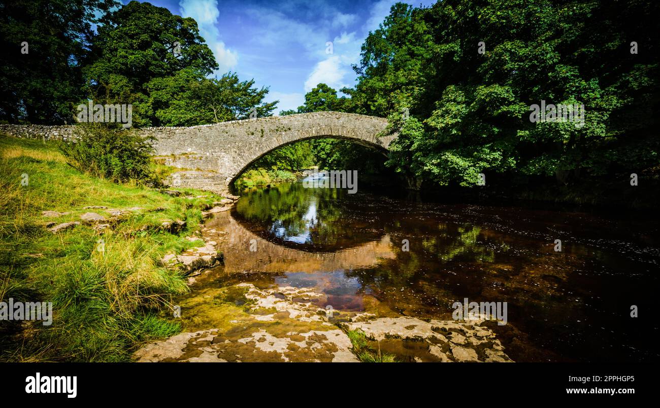 Stainforth packhorse bridge crossing the River Ribble, Yorkshire Dales ...