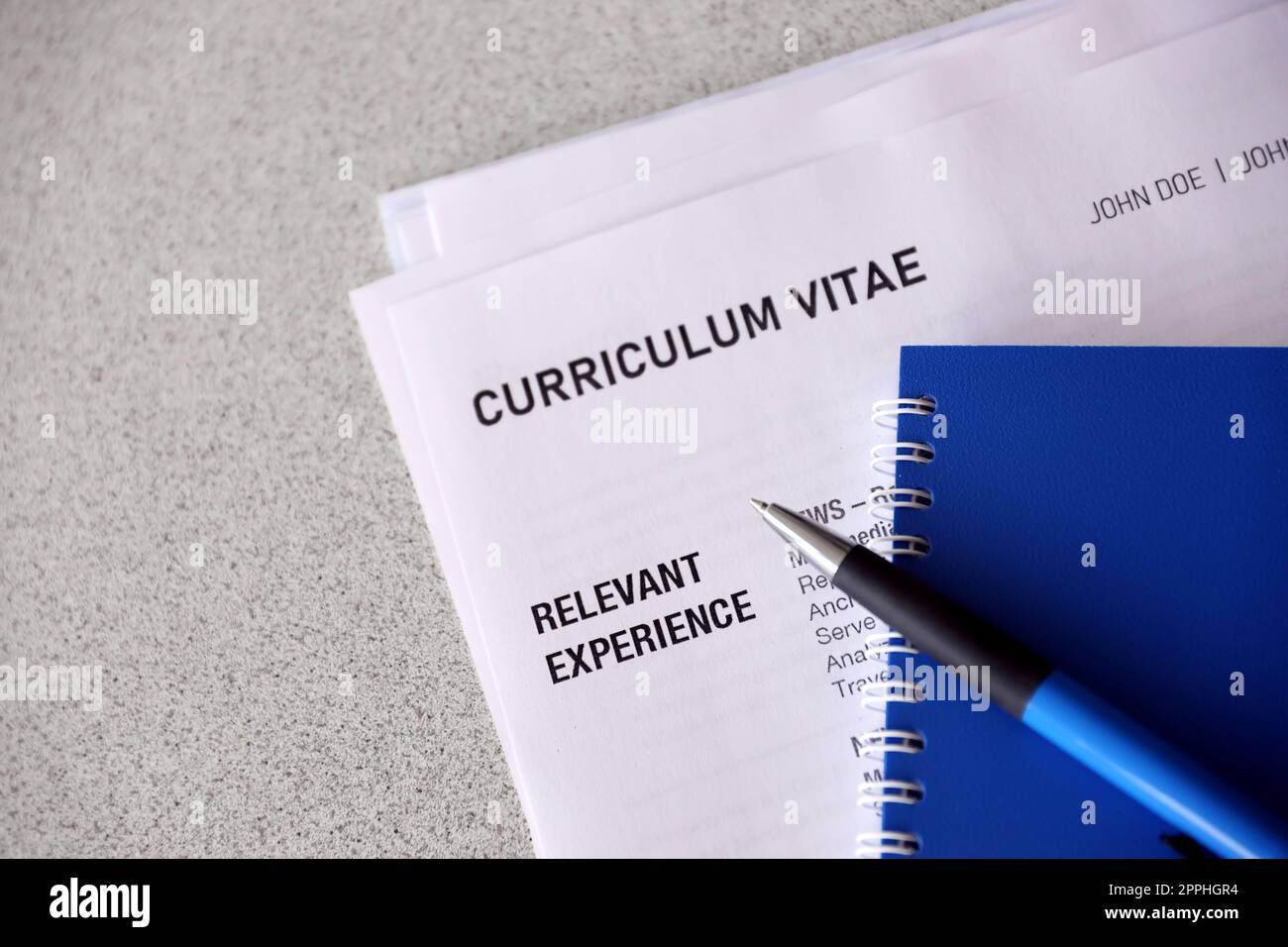 Top view of stack of office documents including resume and cv forms on ...