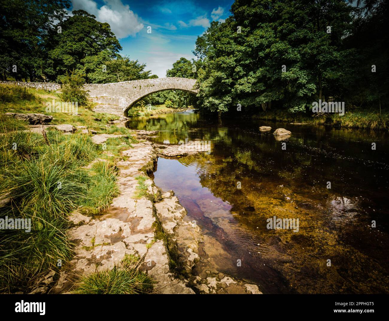 Stainforth packhorse bridge crossing the River Ribble, Yorkshire Dales ...