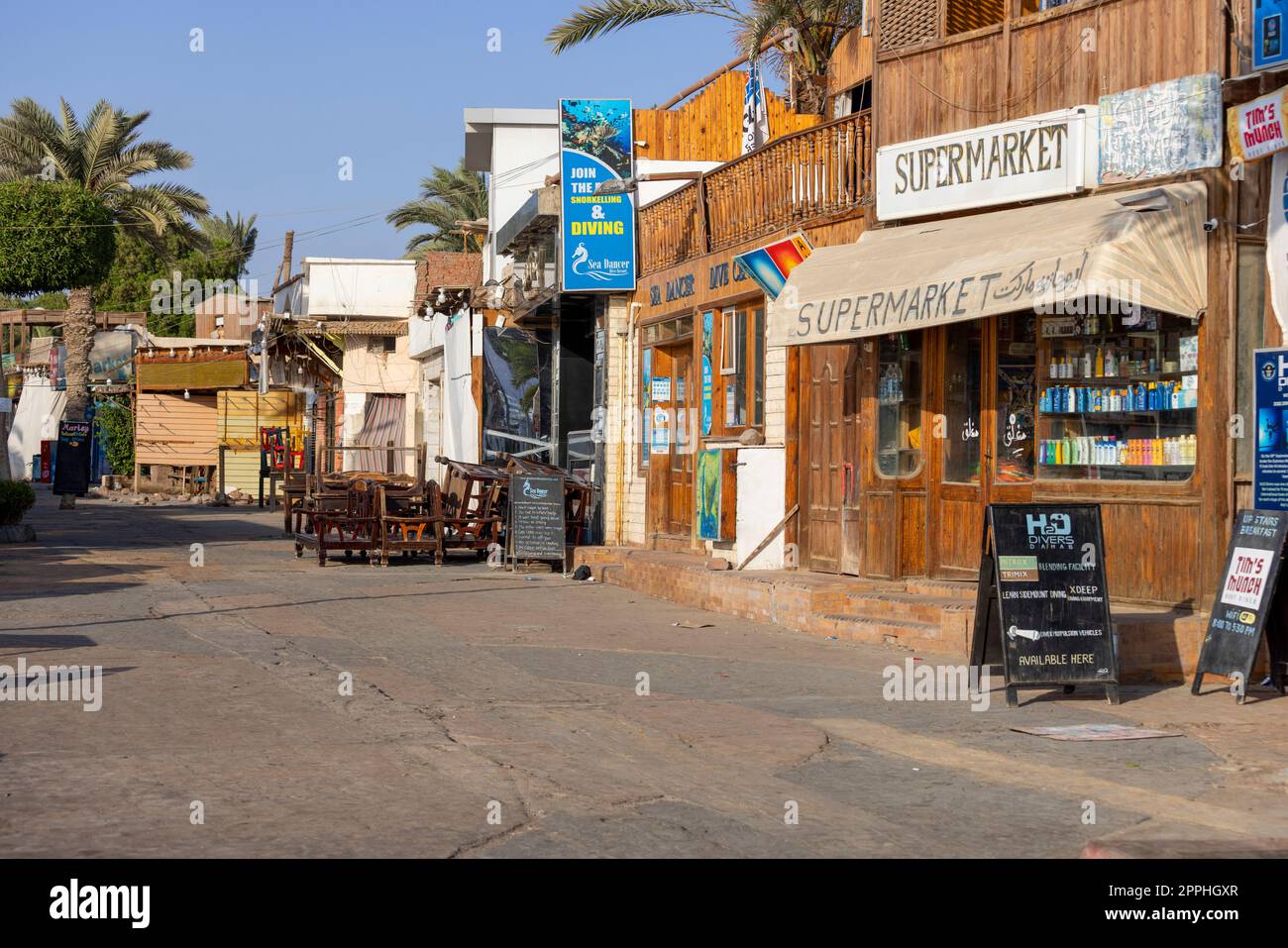 Main promenade with shops and restaurants, everyday life of an exotic ...