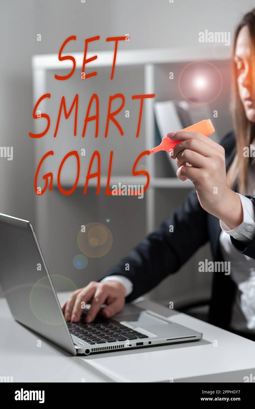 Hand writing sign Set Smart Goals. Word for Establish achievable ...