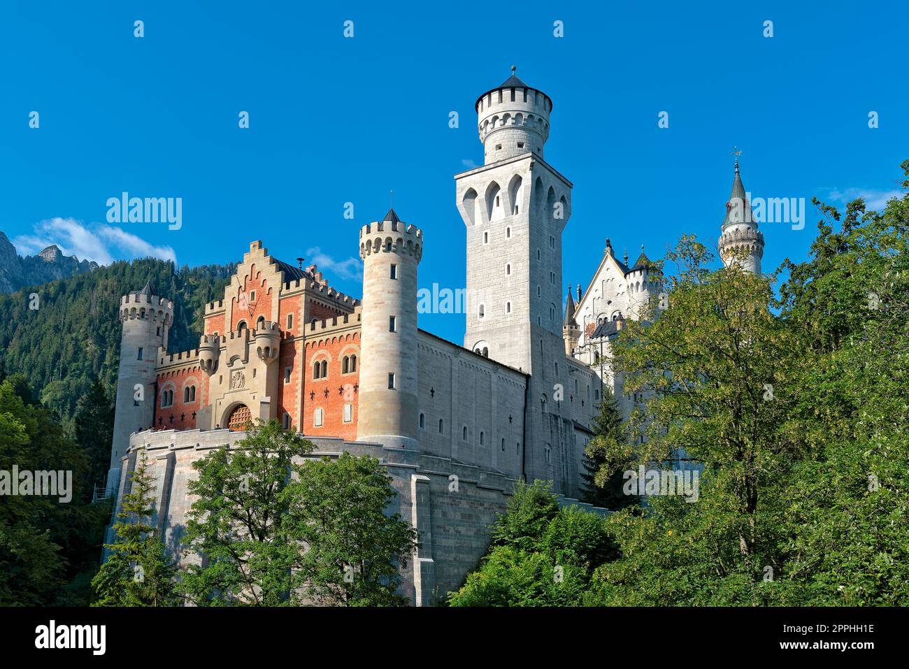 Front view of the facade of Neuschwanstein Castle with entrance area ...