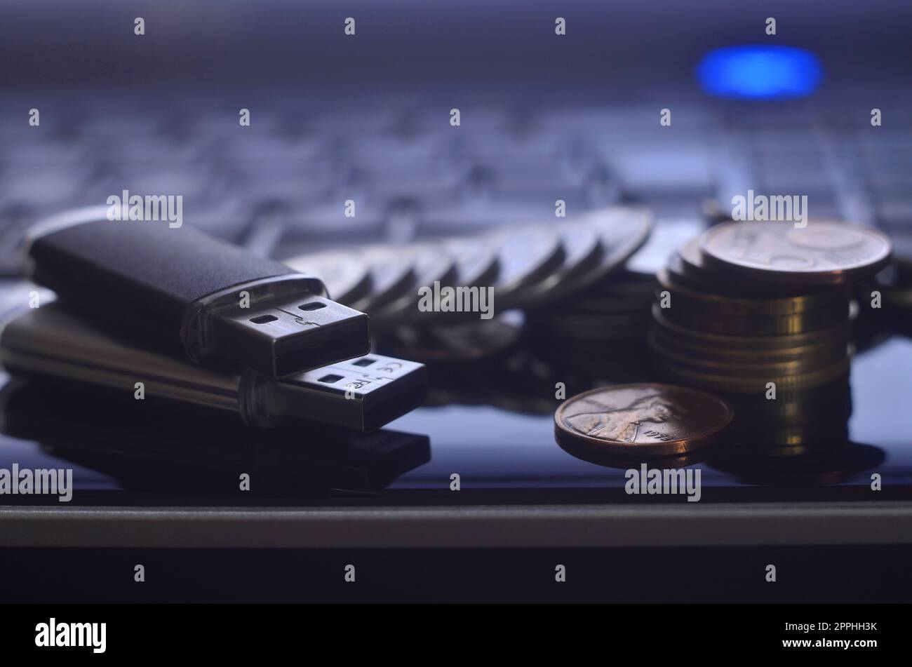 Memory cards and money on the laptop keyboard Stock Photo - Alamy