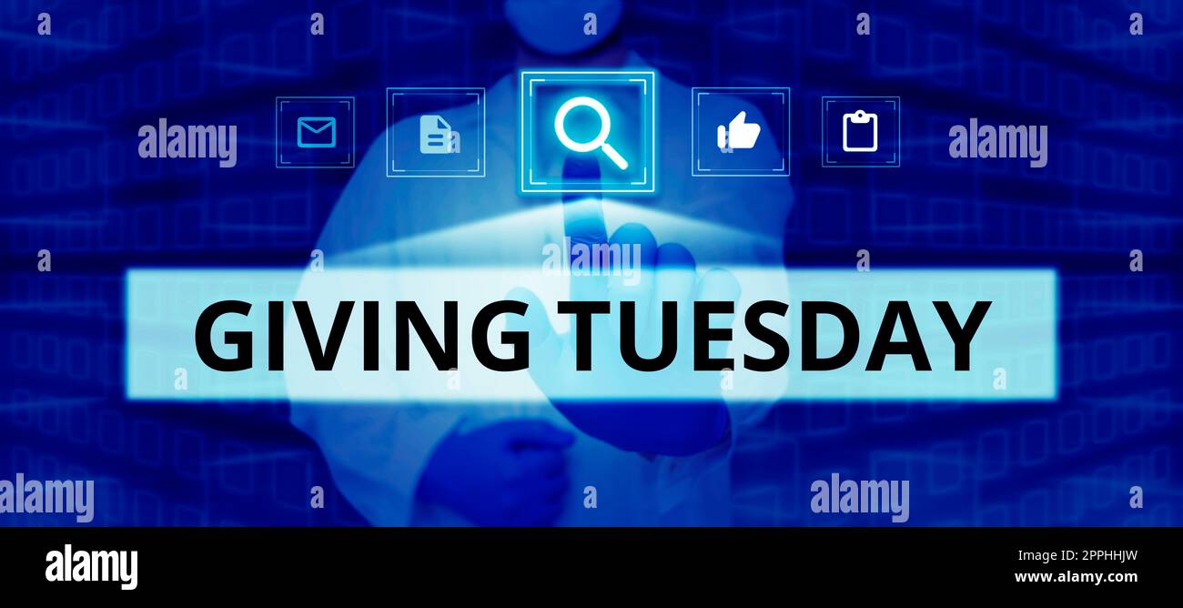 Hand writing sign Giving Tuesday. Business idea international day of ...