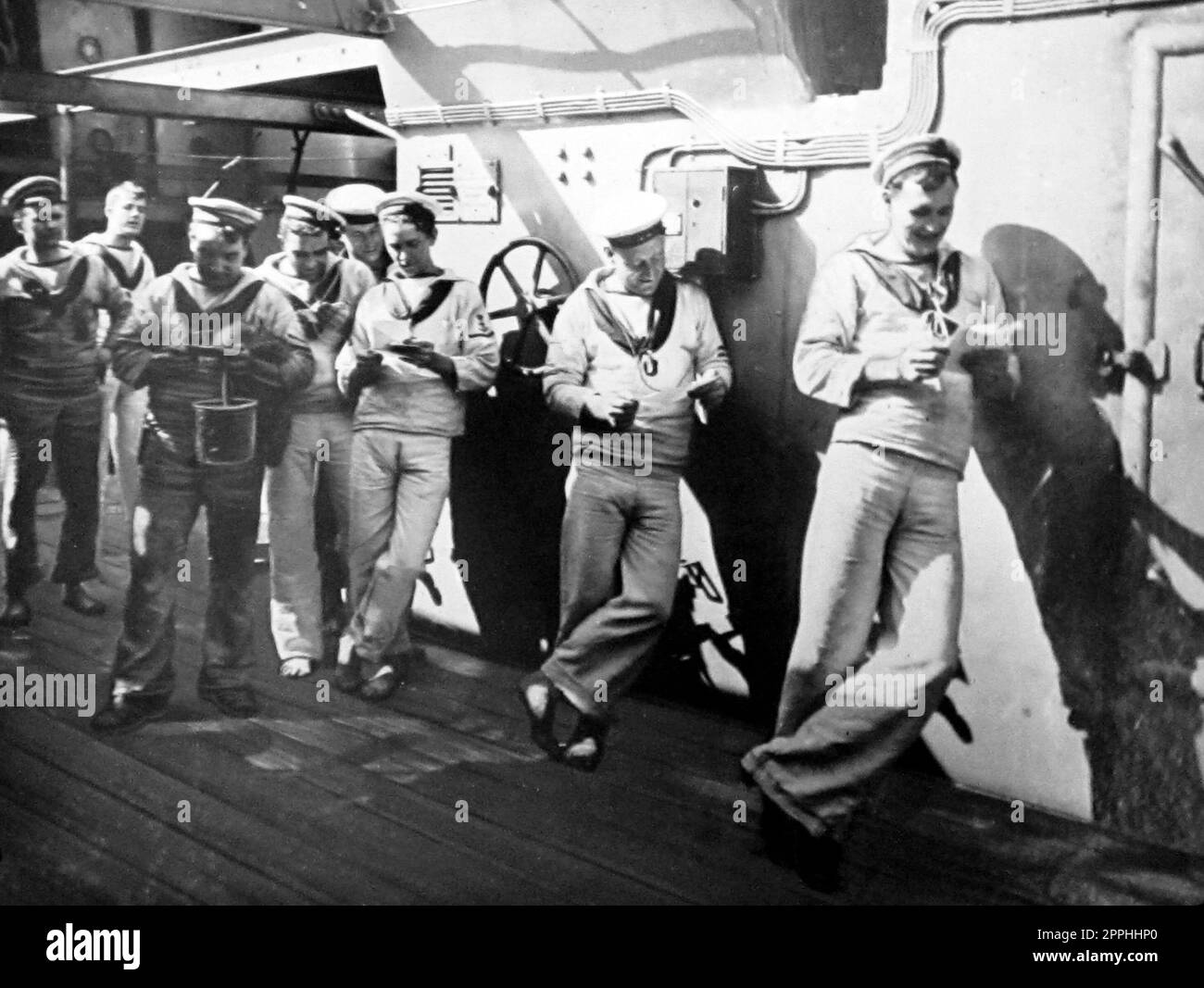 Royal Navy sailors reading letters from home, early 1900s Stock Photo ...