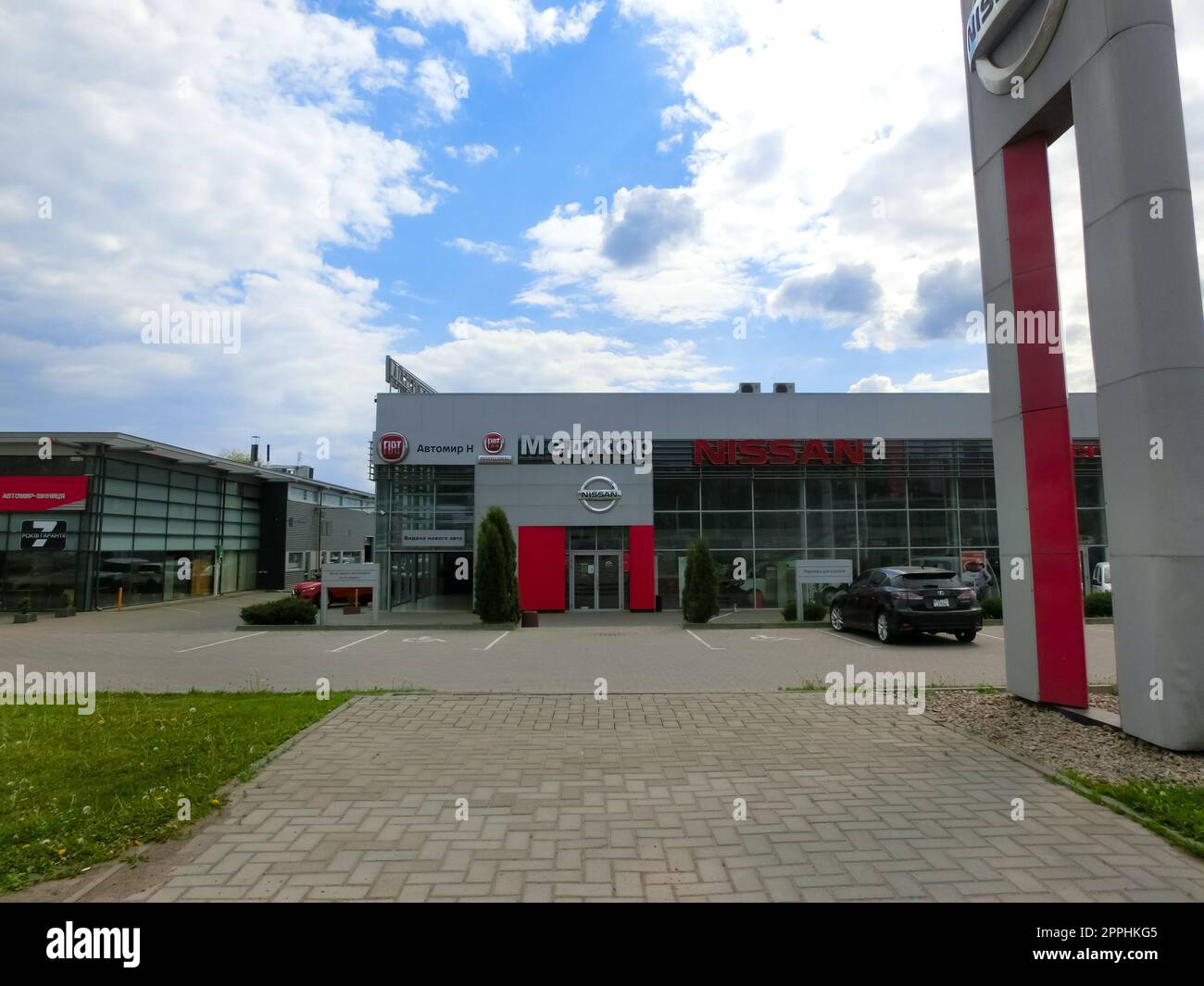 Nissan dealership sign in front of showroom store Japanese brand Stock ...