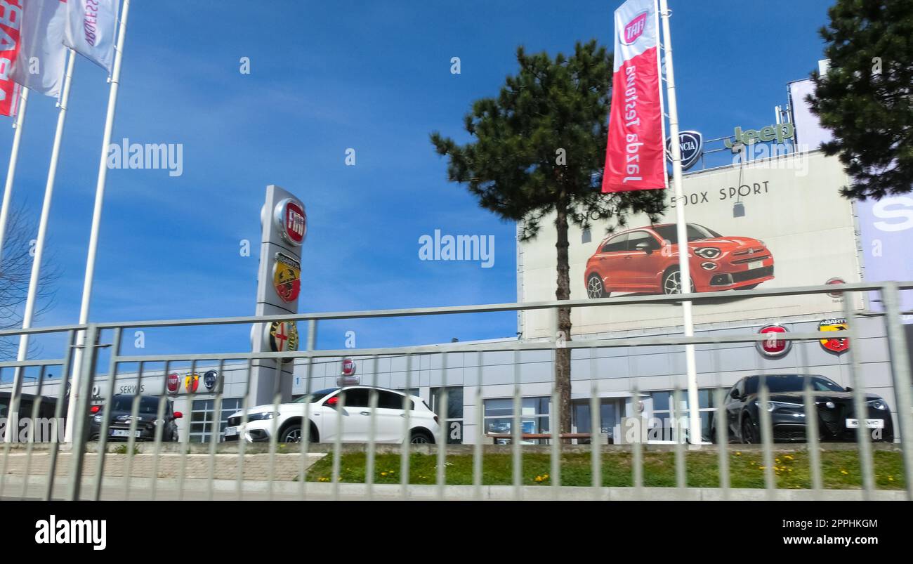 Fiat Automobiles company logo on a dealership building. Italian car ...