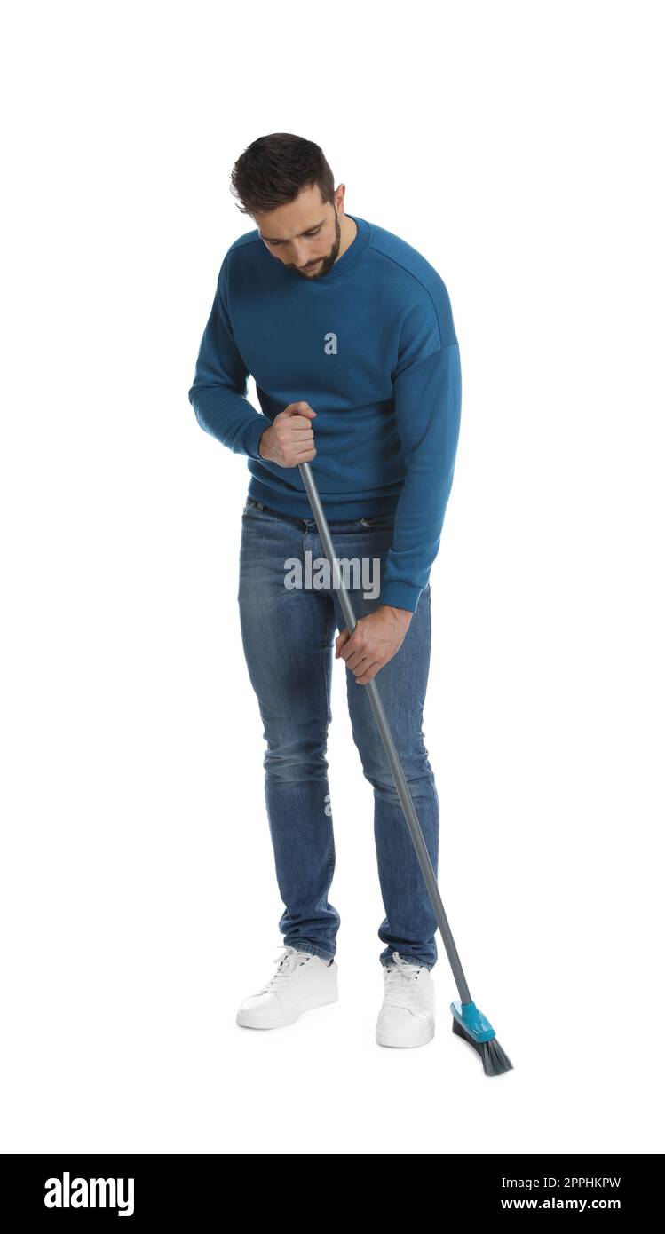 Handsome man with broom on white background Stock Photo - Alamy