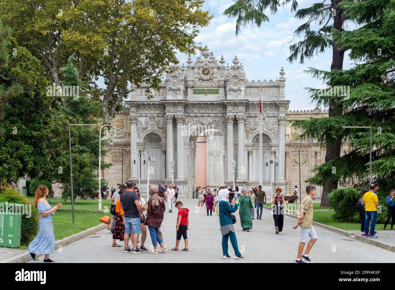 Entrance of Dolmabahce Palace, with many tourists visiting the place ...