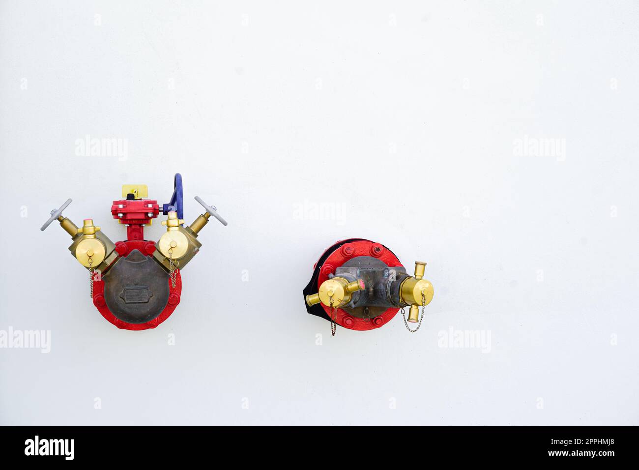 Red fire extinguishing system Stock Photo - Alamy