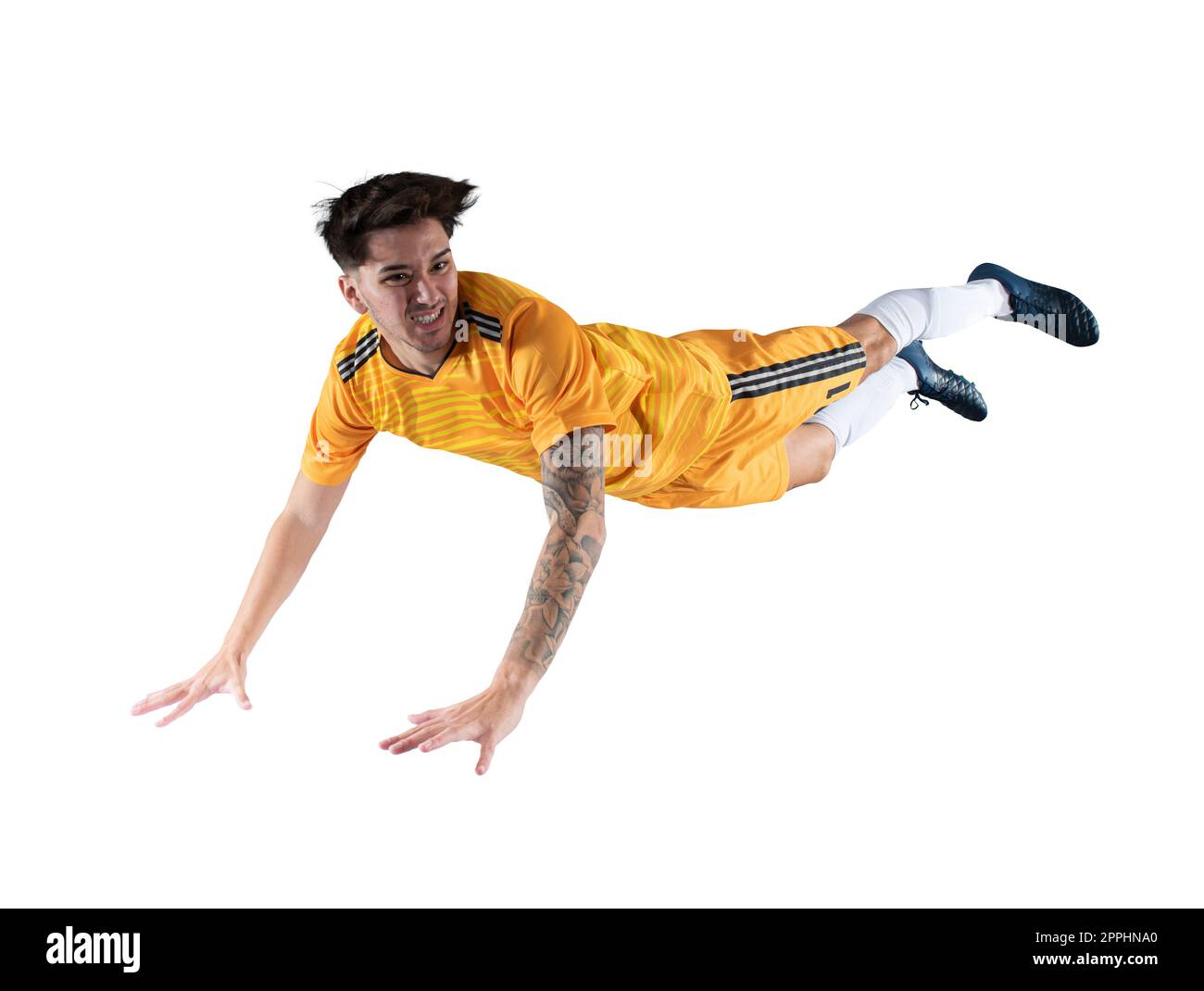 Football striker player with yellow team suit jumps Stock Photo - Alamy