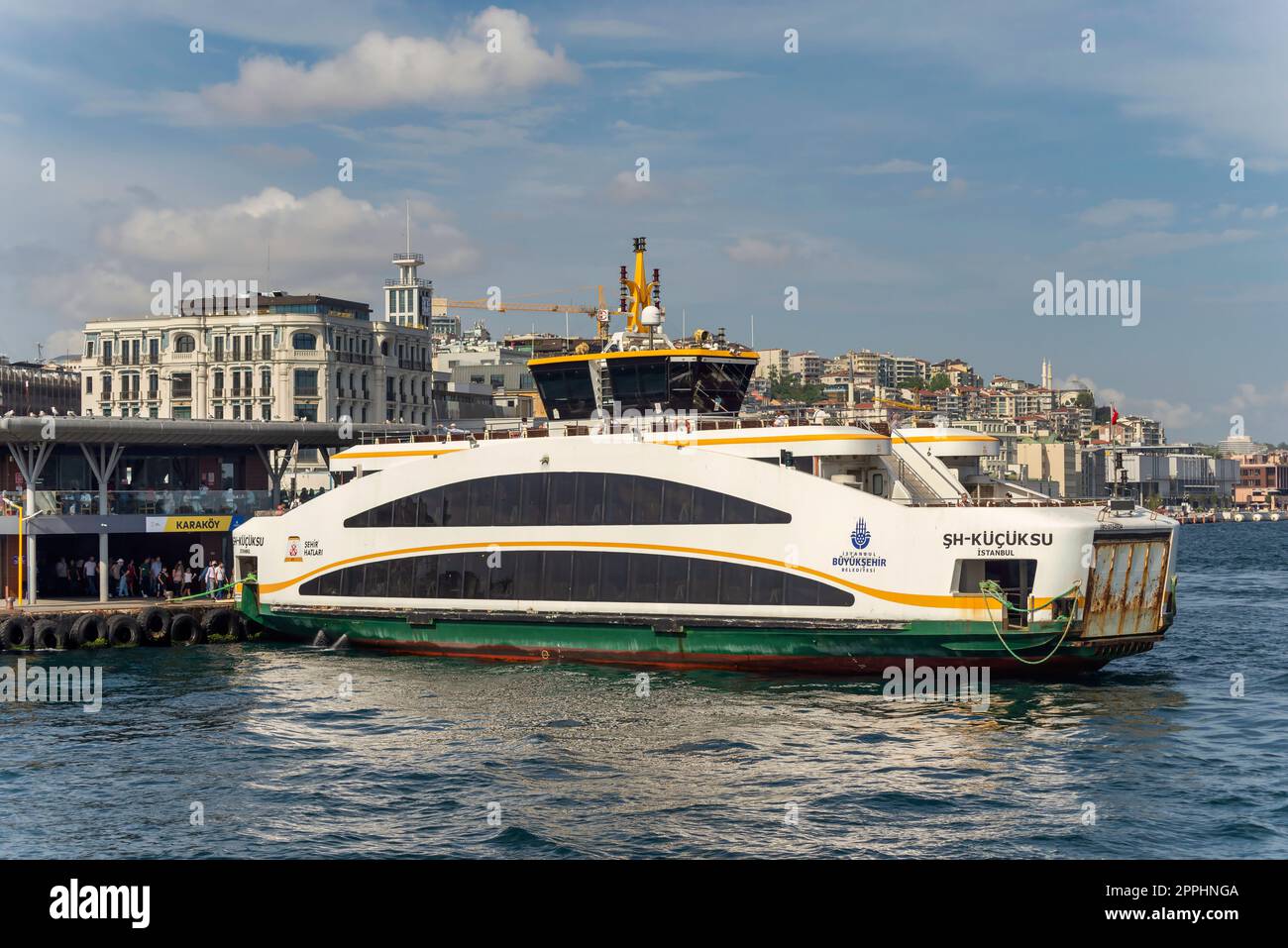 Small ferry boat docked at Karakoy ferry terminal, in a sunny summer ...