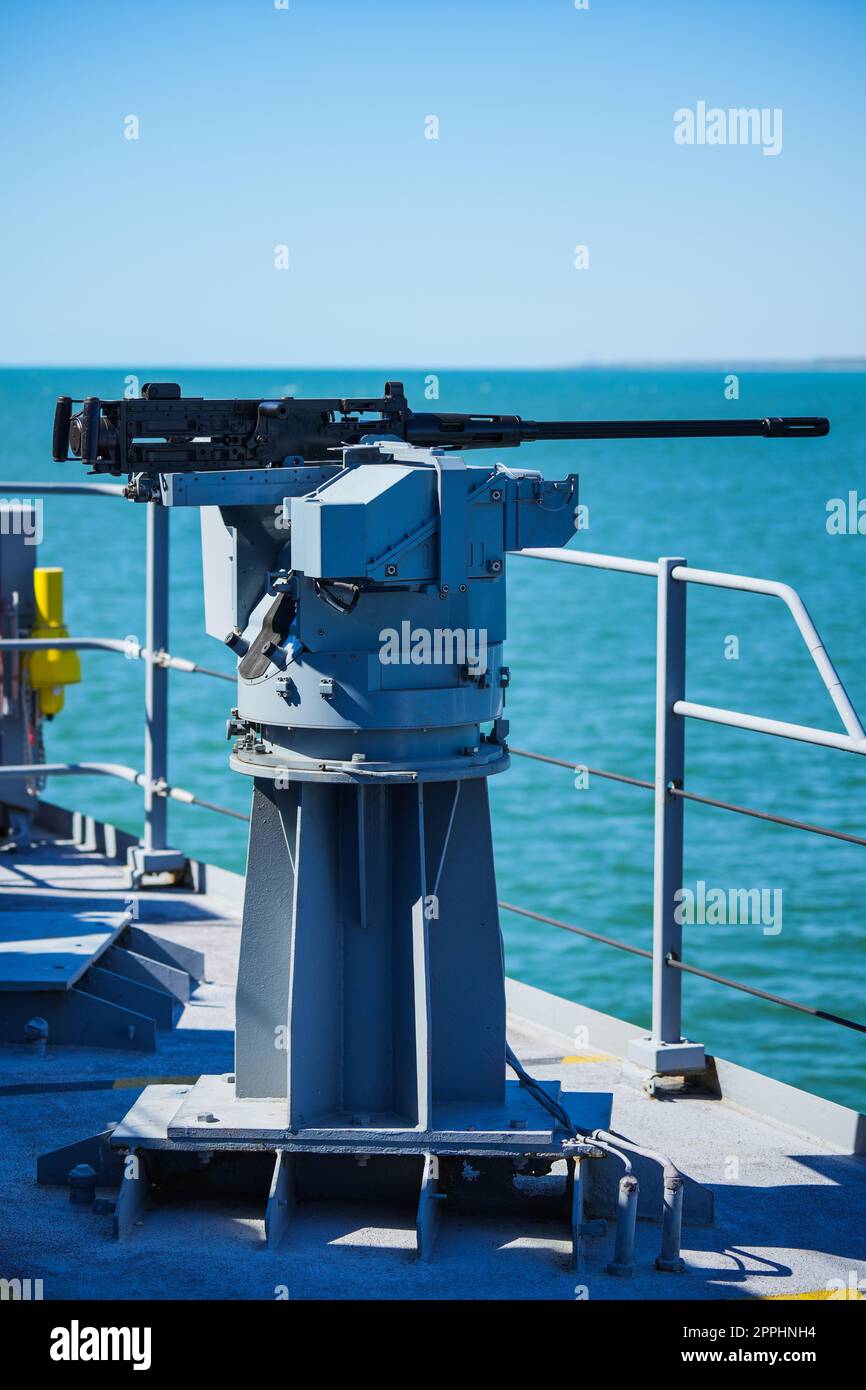 Automated machine gun on the deck of a military ship Stock Photo - Alamy