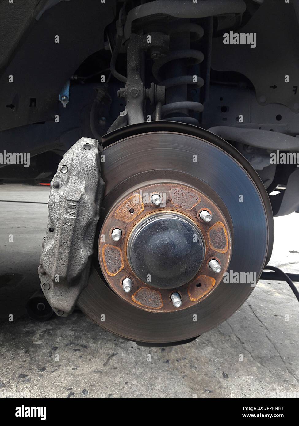 brake discs on the machine with the removed wheels on the jacks. wheel ...