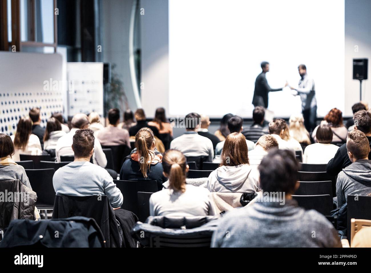 Startup team giving a pitch deck presentation in conference hall at ...