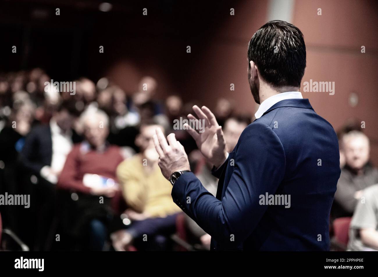 Speaker giving a talk on corporate Business Conference. Audience at the ...