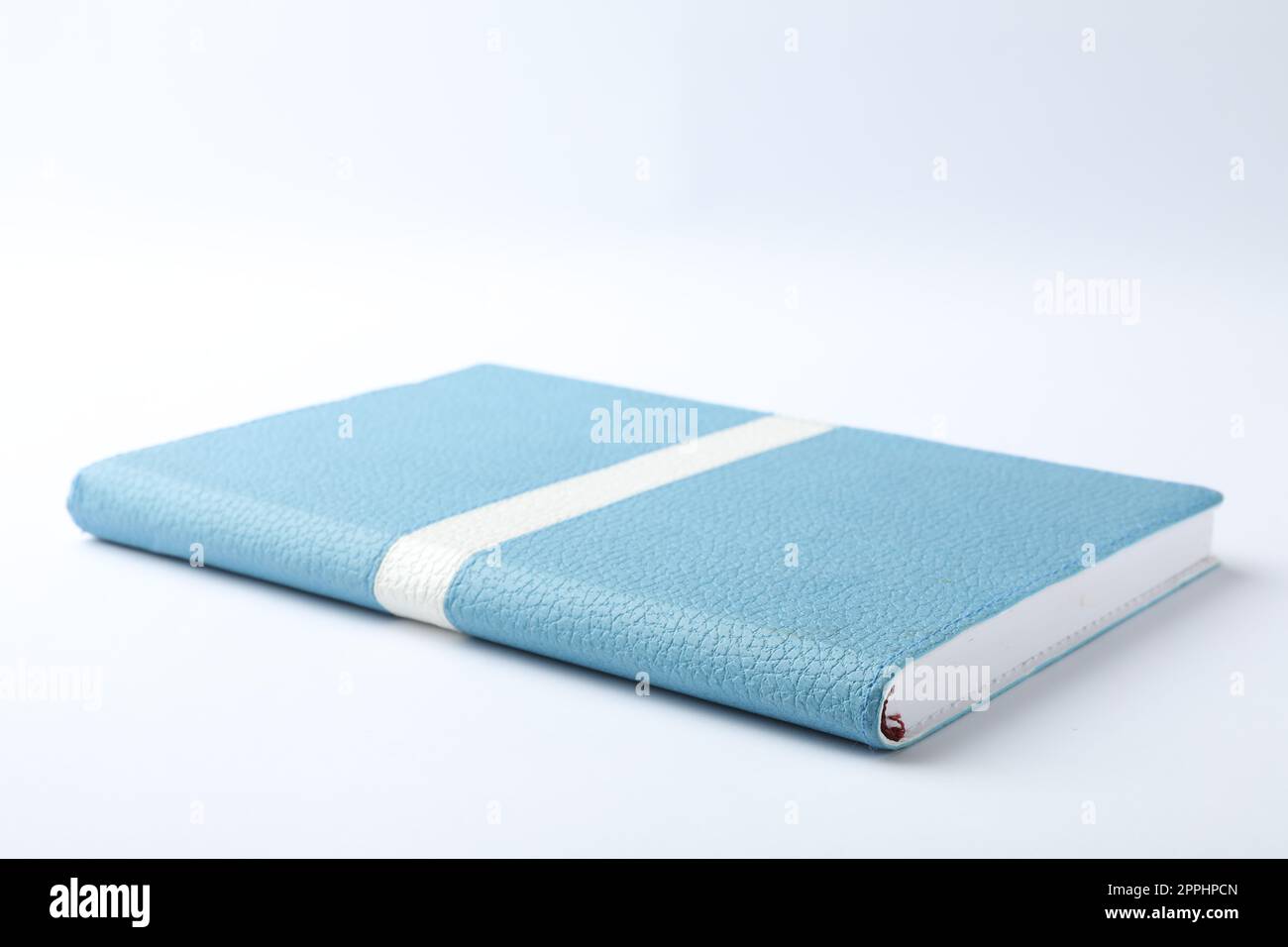 Stylish light blue notebook isolated on white Stock Photo - Alamy