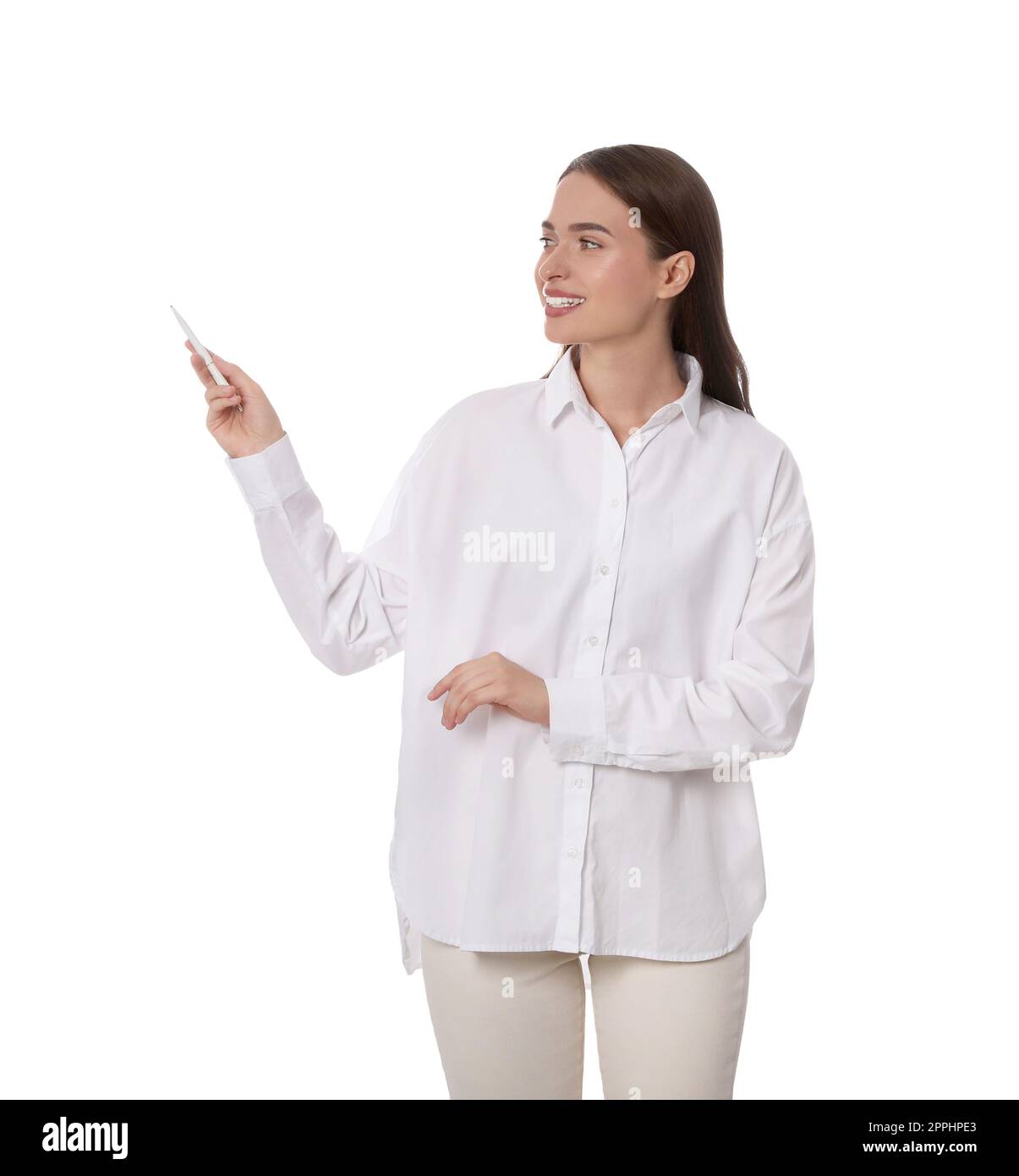 Beautiful woman pointing at something with pen on white background ...