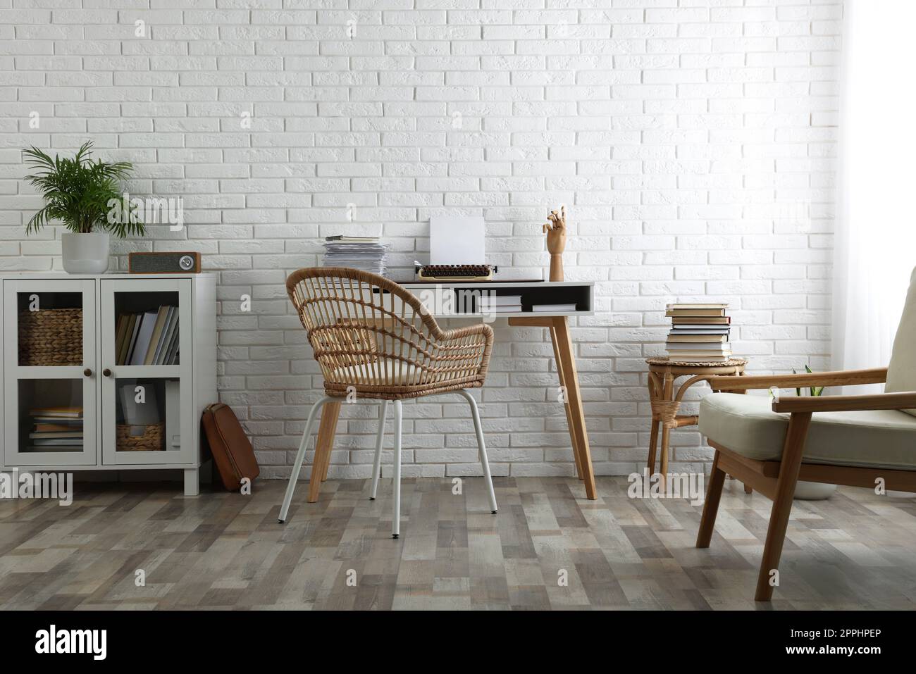 Comfortable writer's workplace interior with typewriter on desk near ...