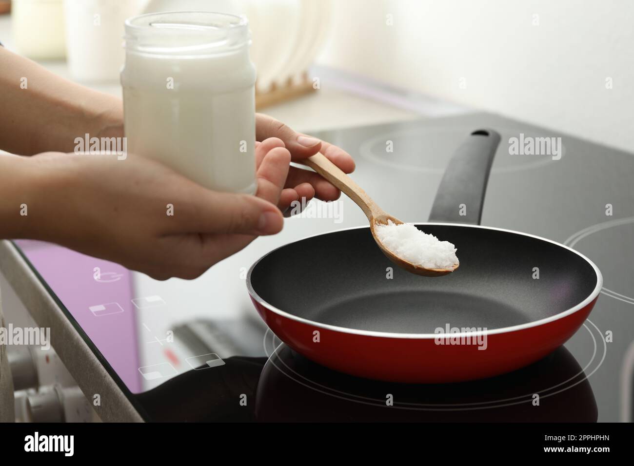 Woman coconut oil cook hi-res stock photography and images - Alamy