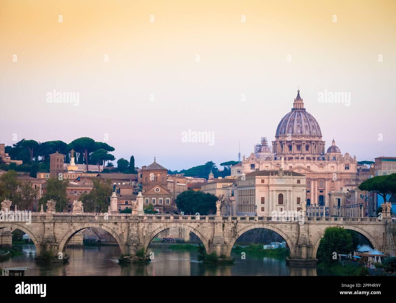 Sunset on Tiber river bridge with Vatican City - Rome, Italy Stock ...