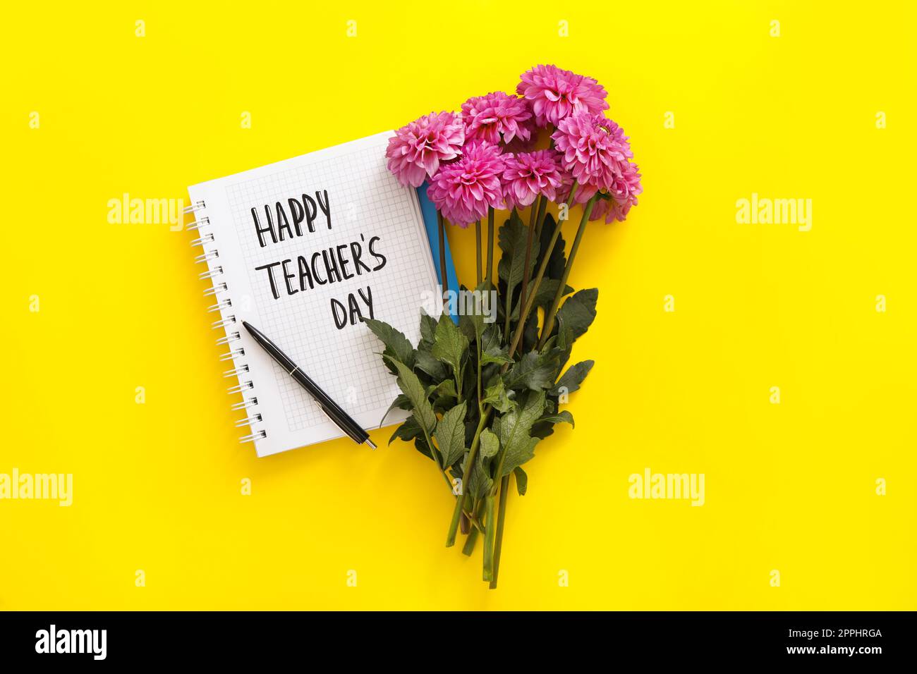Beautiful flowers and notebook with words HAPPY TEACHER'S DAY on yellow ...