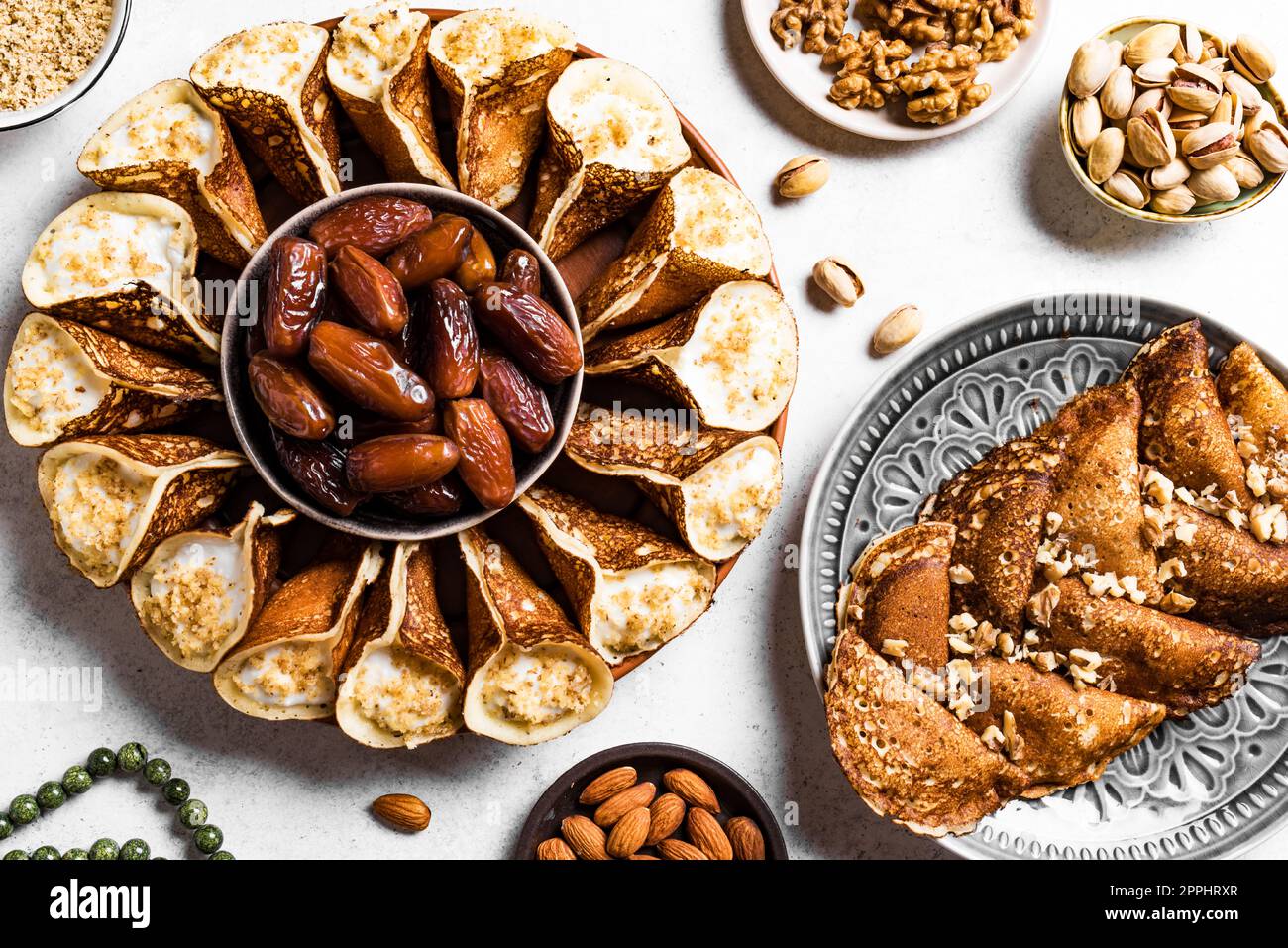 Middle eastern arabian iftar dessert qatayef or atayef, a crescent ...