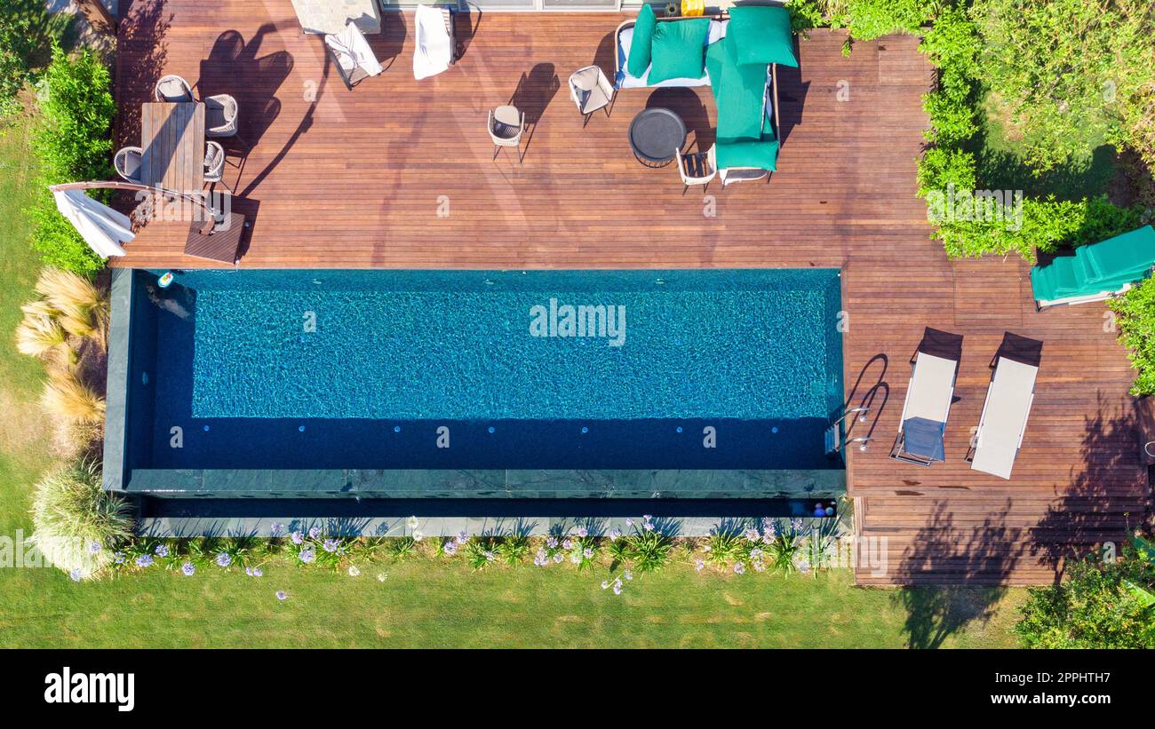 Swimming Pool viewed from above. Top down view of modern luxury villa ...