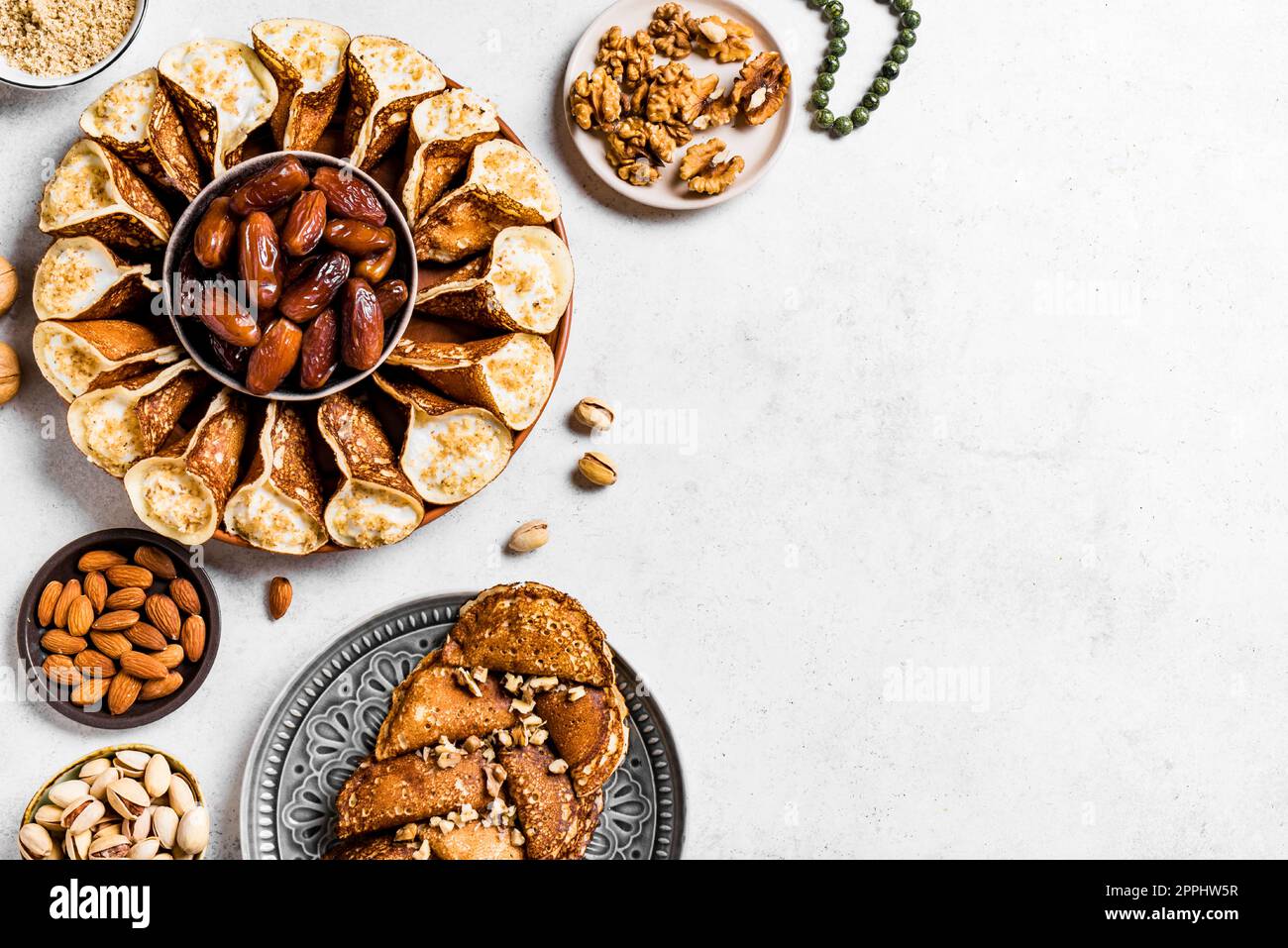 Middle eastern arabian iftar dessert qatayef or atayef, crescent shaped ...