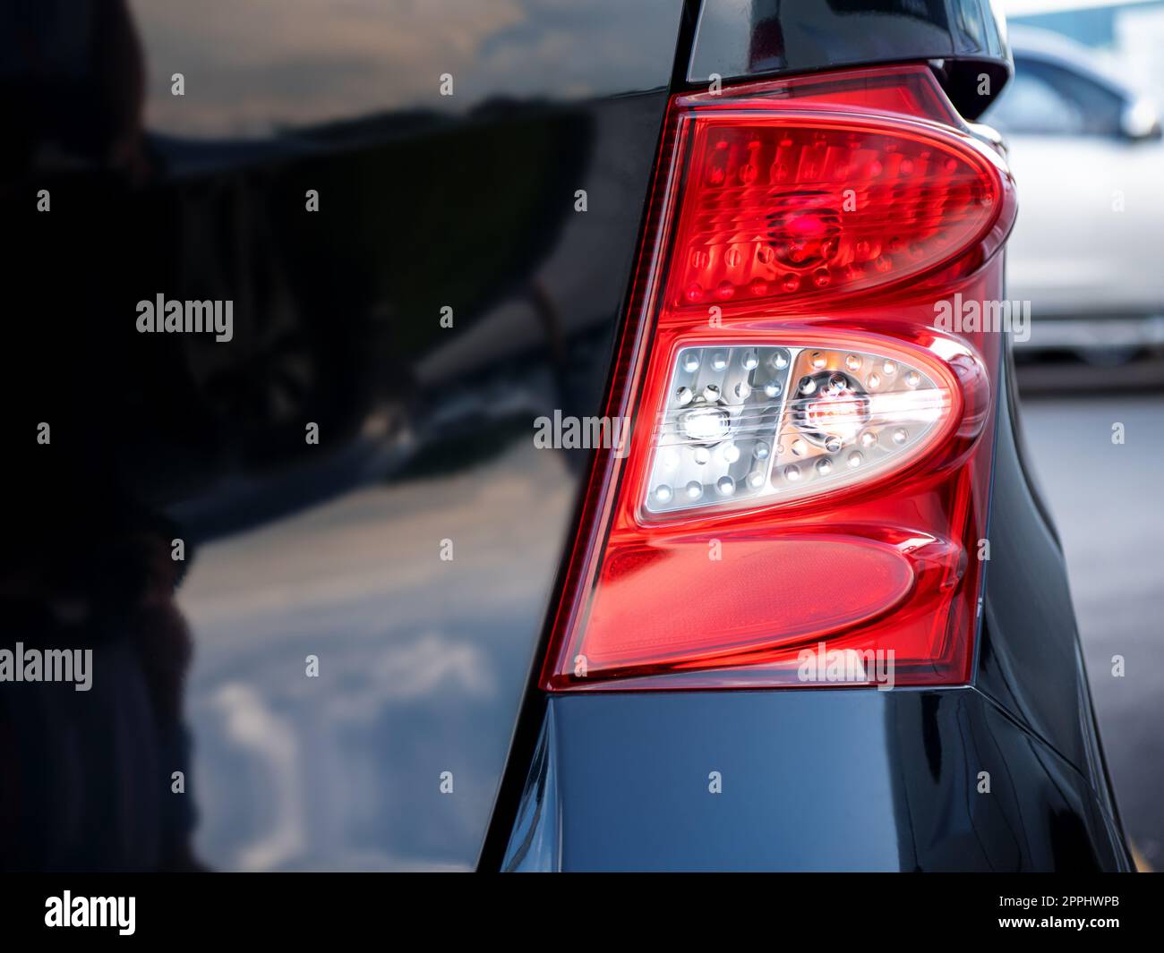 Rear view of car with red tail lights on hi-res stock photography and ...