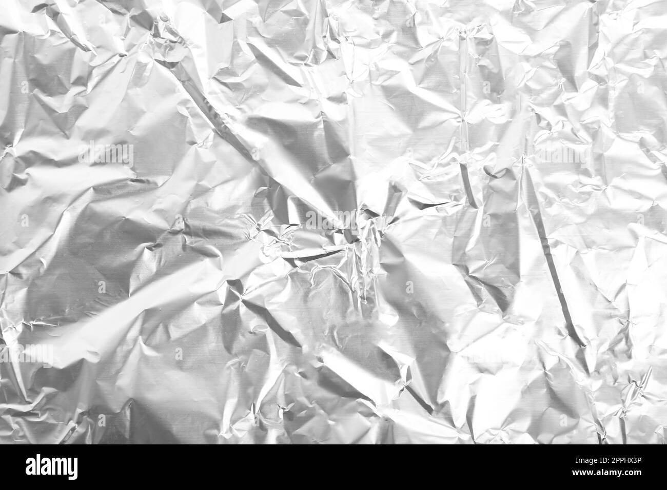 Crumpled silver foil as background, closeup view Stock Photo - Alamy