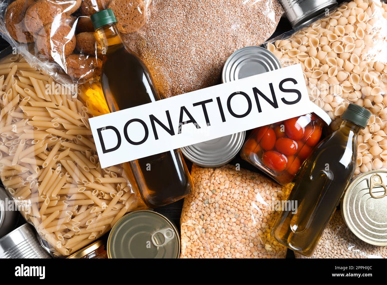 Card with word Donations on different products, top view Stock Photo ...