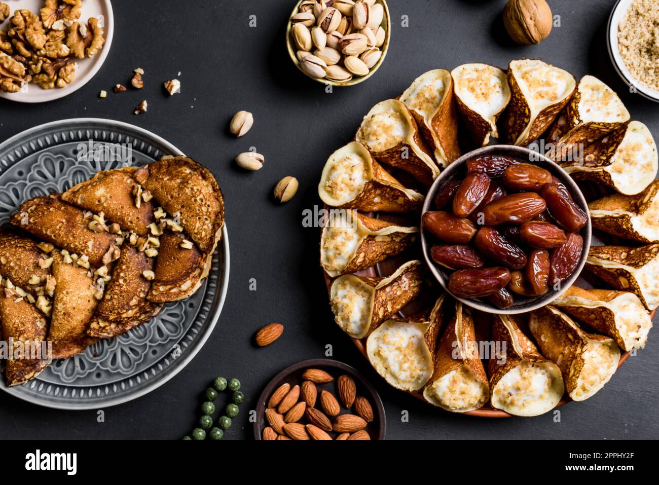 Middle eastern arabian iftar dessert qatayef, a crescent-shaped filled ...