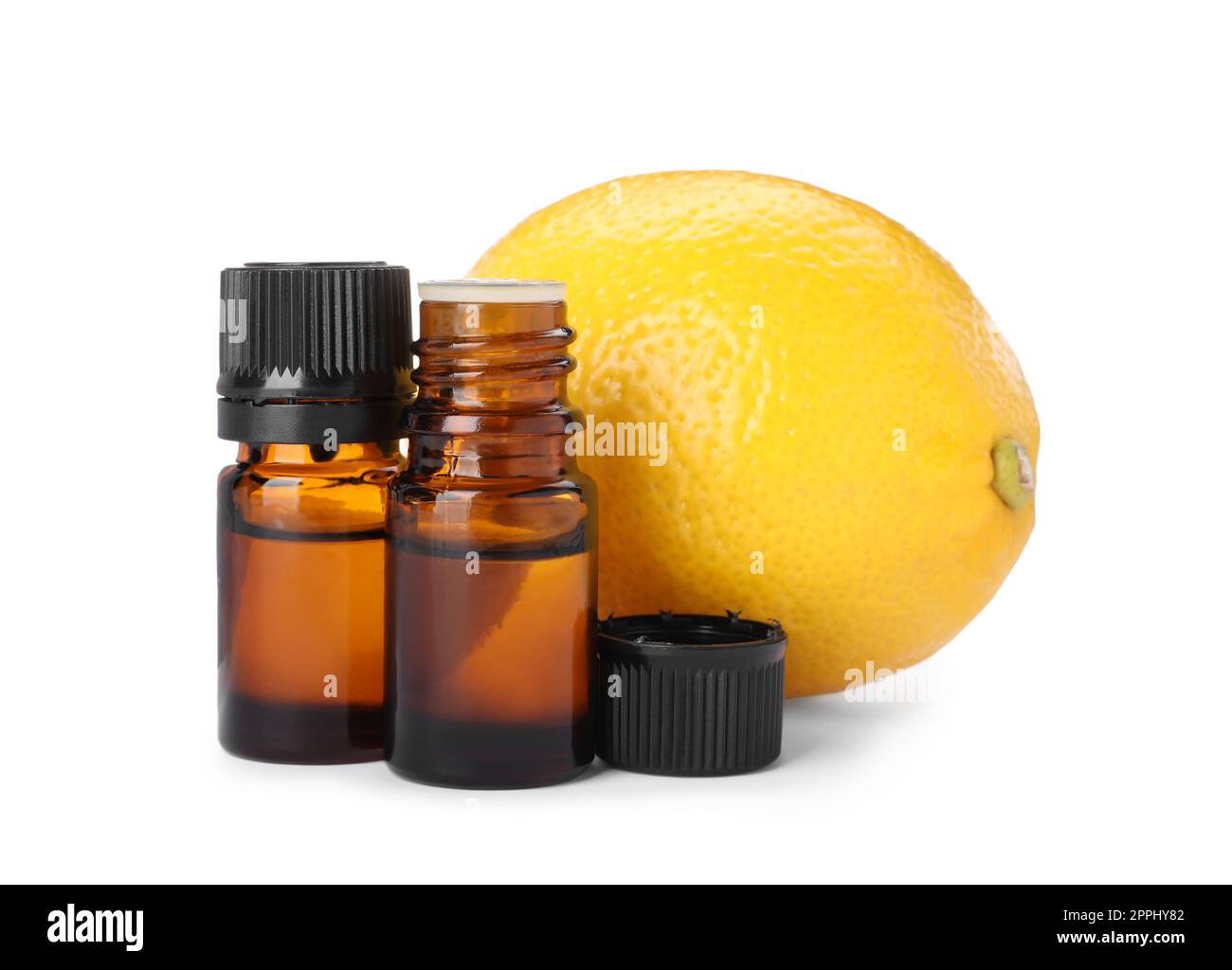 Bottles of citrus essential oil and fresh lemon isolated on white Stock ...
