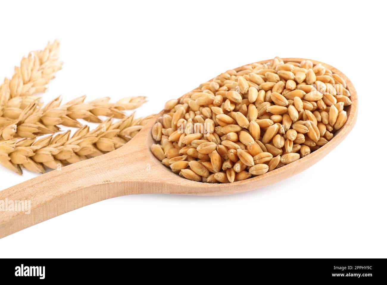 Wooden spoon with wheat grains and spikes on white background Stock ...
