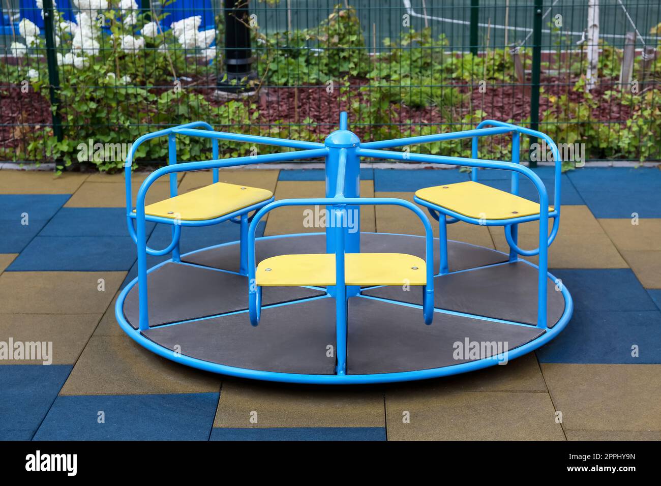 Colourful carousel for children on outdoor playground Stock Photo - Alamy