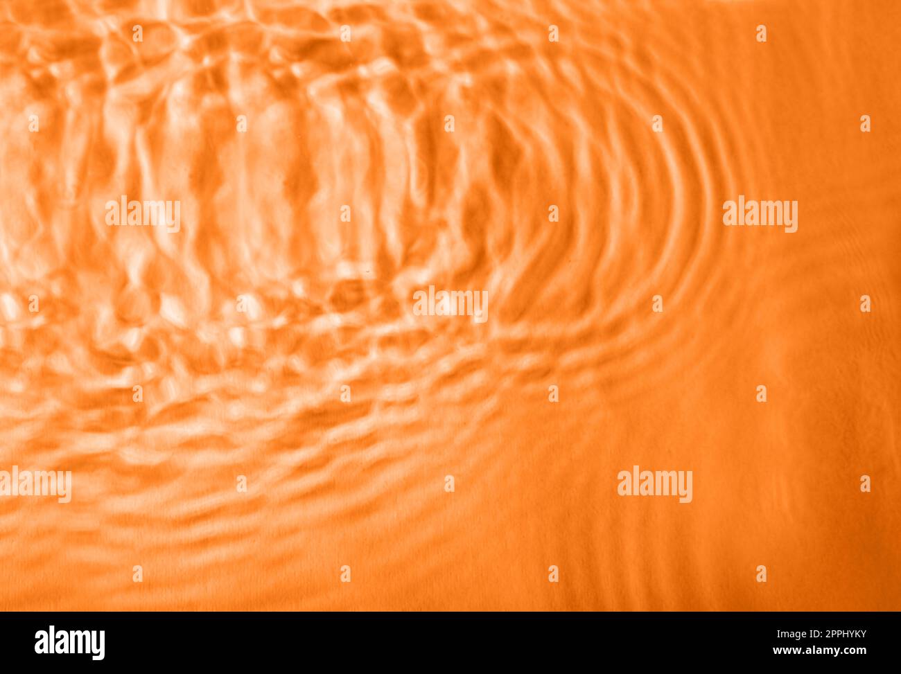 Concentric waves on water surface after falling drops, top view. Toned ...