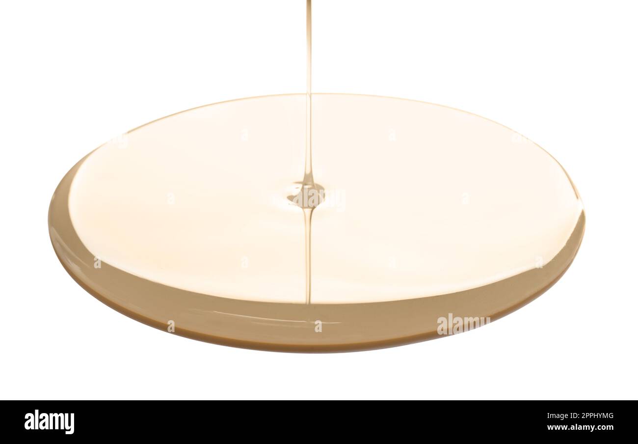 Vegetable oil pouring on puddle against white background Stock Photo ...