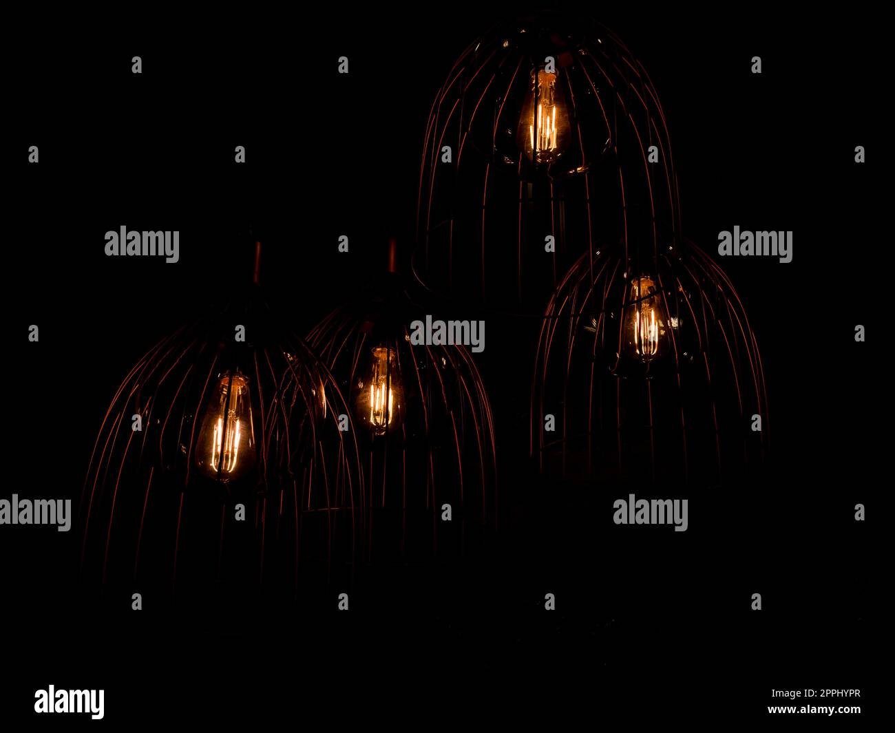 Vintage incandescent light bulb filament on black, close up shot Stock ...