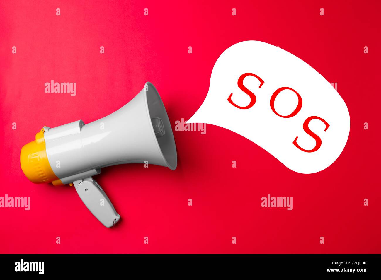Electronic megaphone and word SOS on red background. Asking for help ...