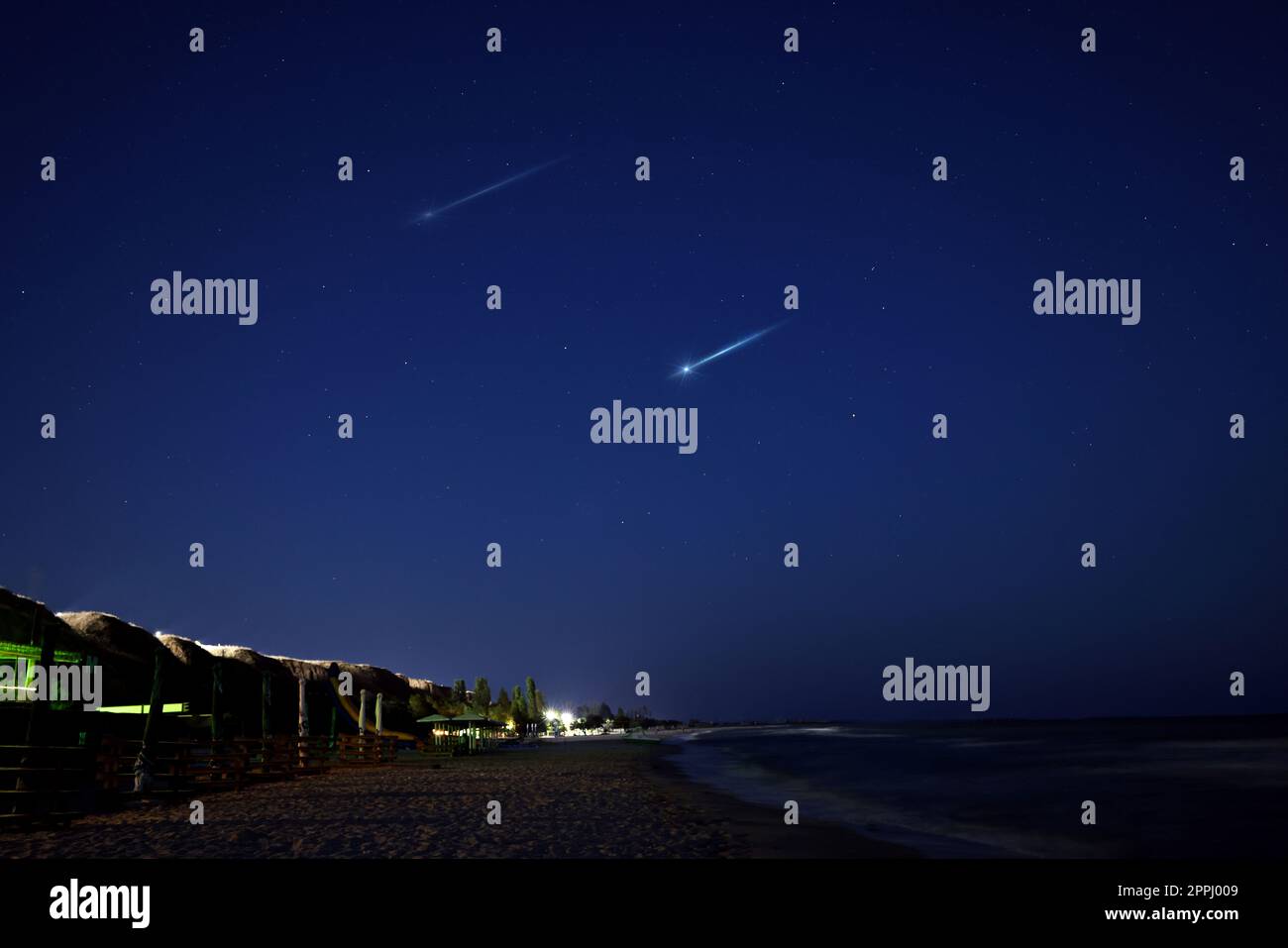 Beautiful view of shooting stars in night sky Stock Photo - Alamy