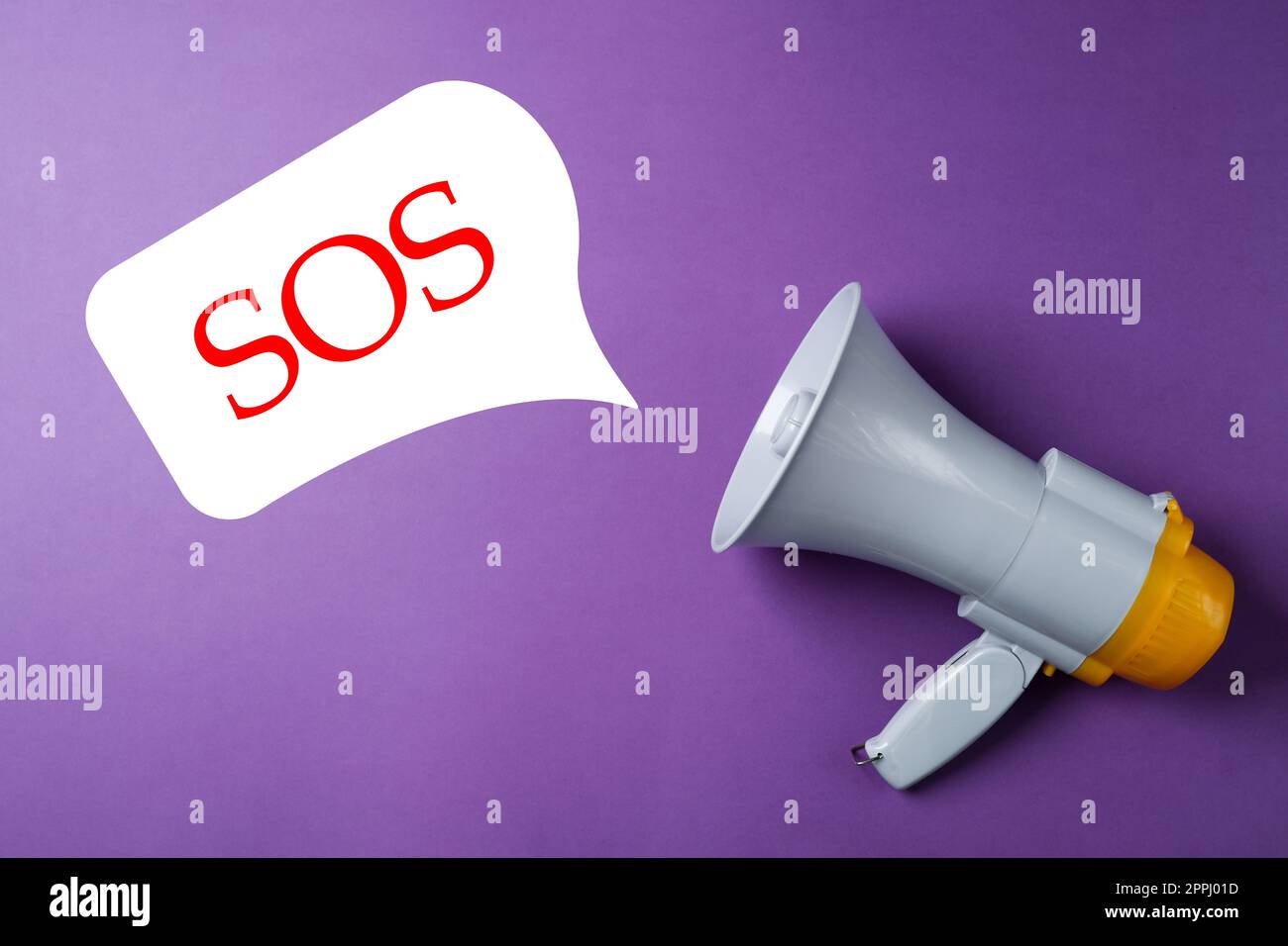 Electronic megaphone and word SOS on violet background. Asking for help ...