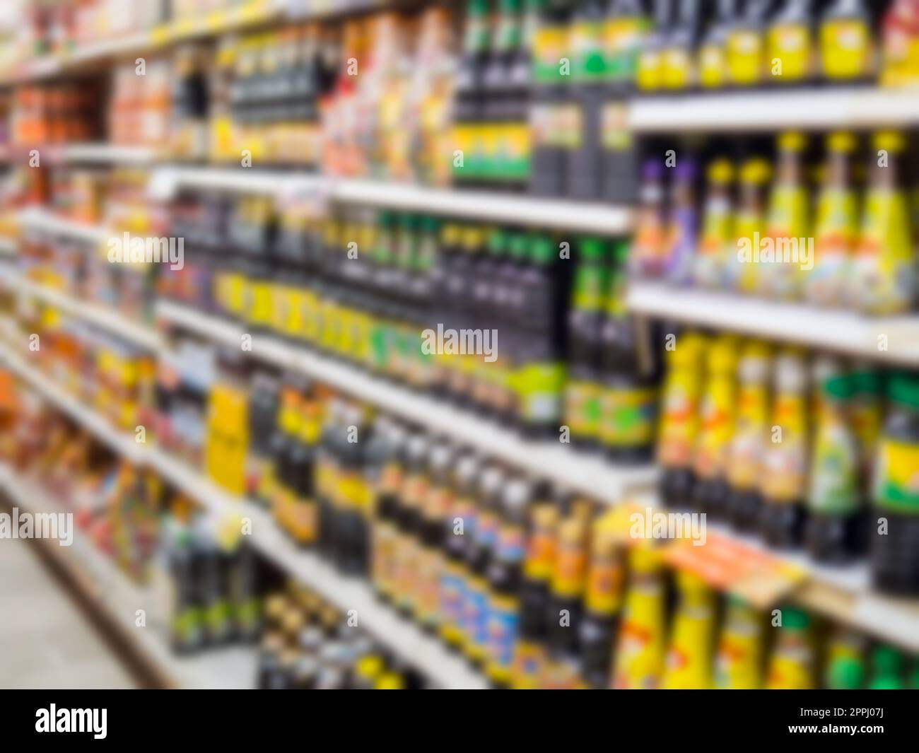 Blurred store shelves, sauce section at a supermarket Stock Photo - Alamy