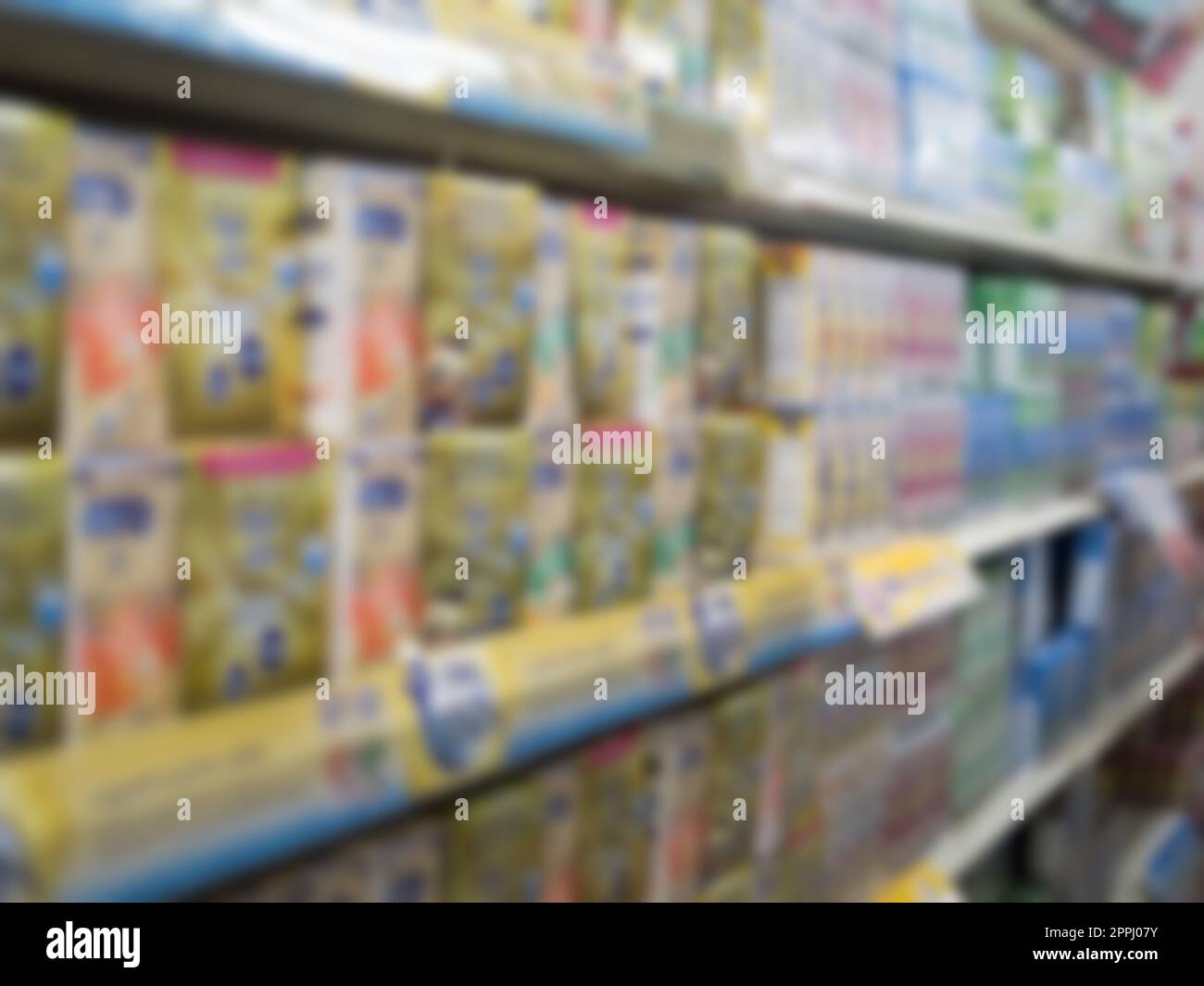 Blurred store shelves, milk section at a supermarket Stock Photo - Alamy