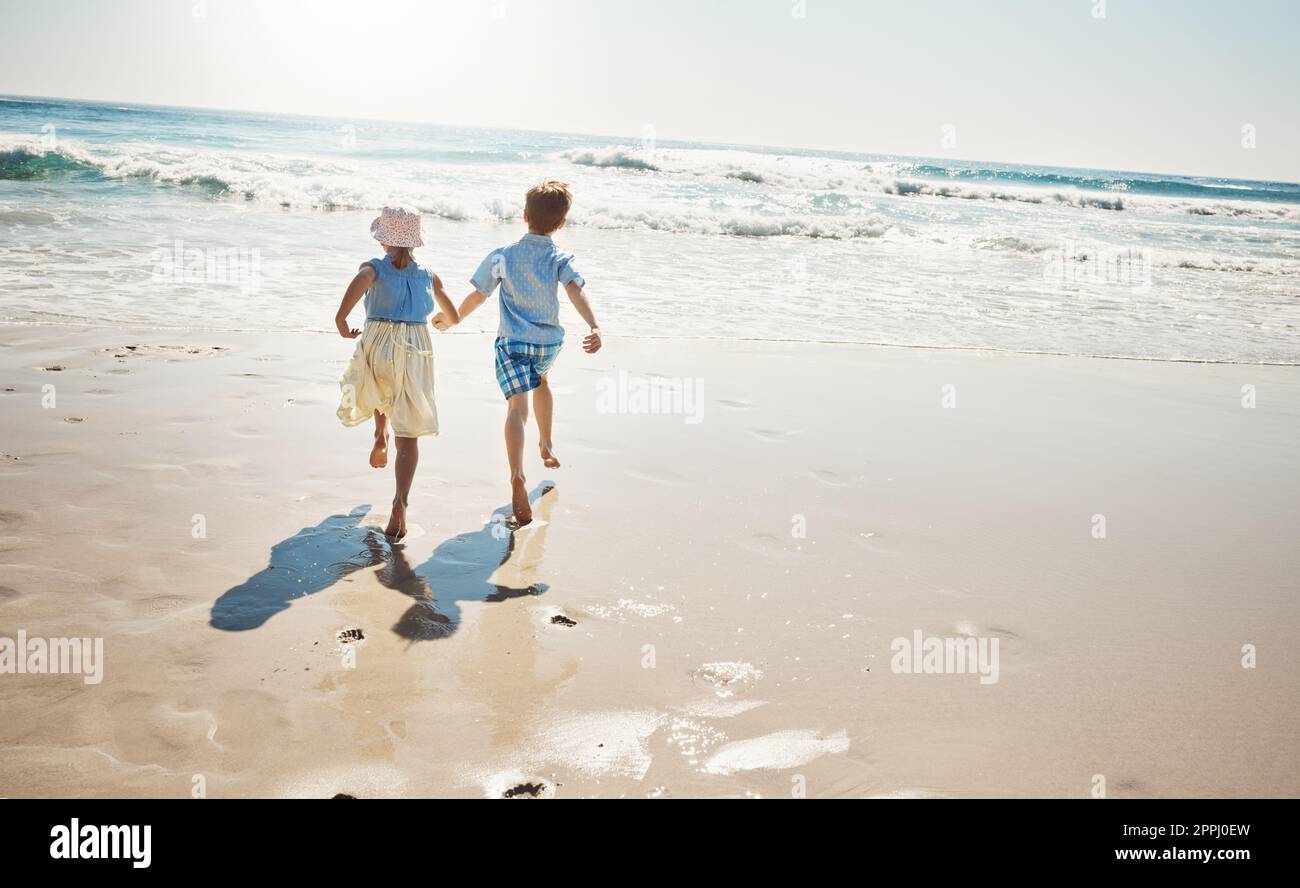 Kids are always out to seek fun. two adorable young children running ...