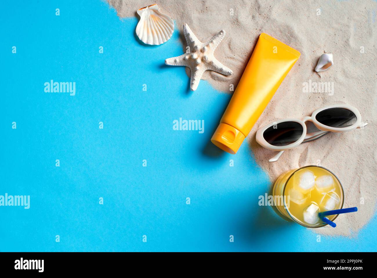 Summer composition with sunblock lotion bottles, starfish, sea shells ...