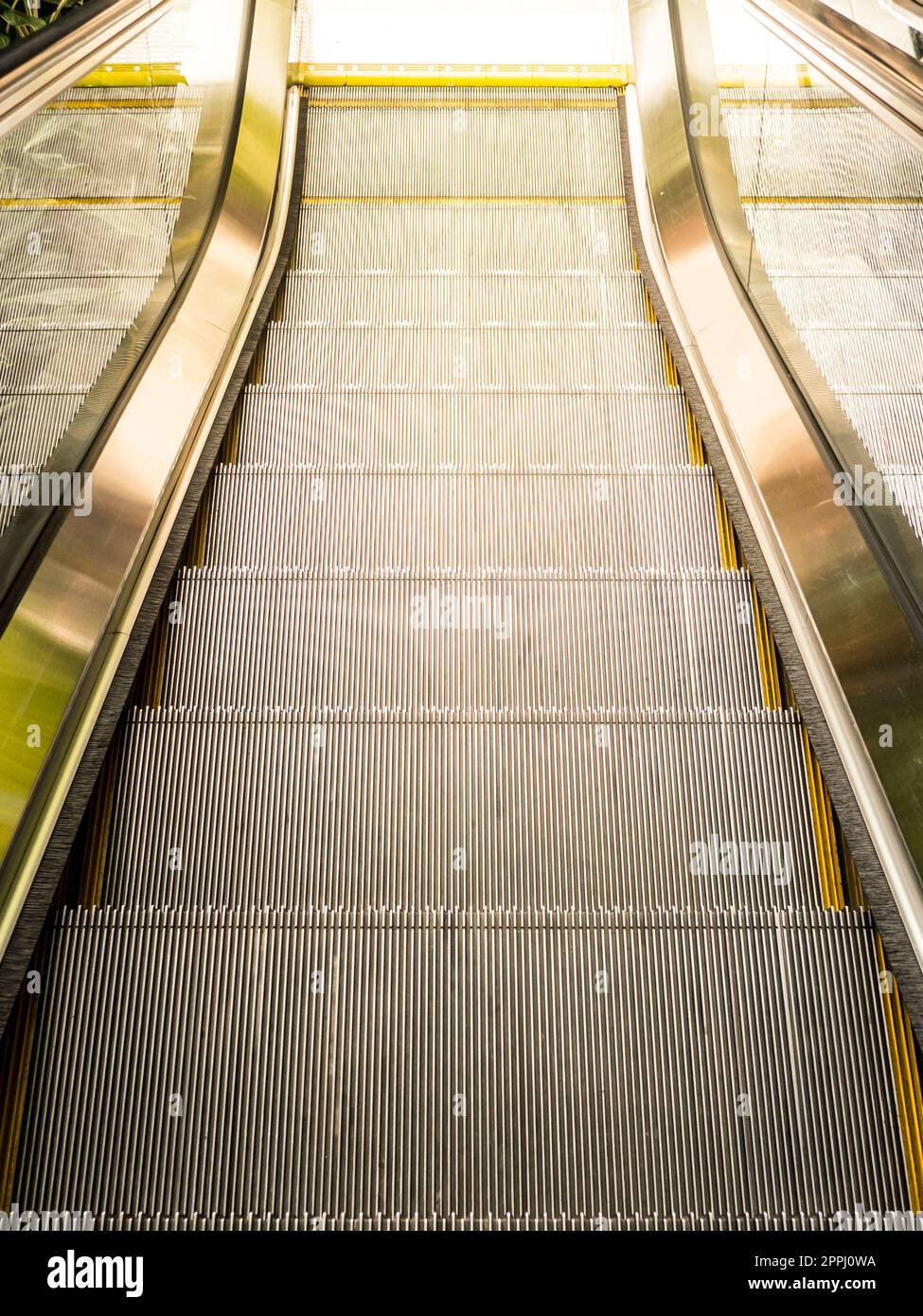 Top view of escalators , sun light from outside Stock Photo - Alamy