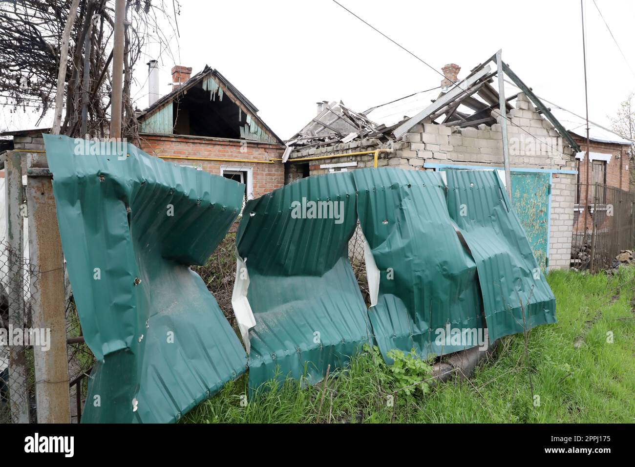 SLOVIANSK, UKRAINE - APRIL 21, 2023 - A damaged fence remains outside ...