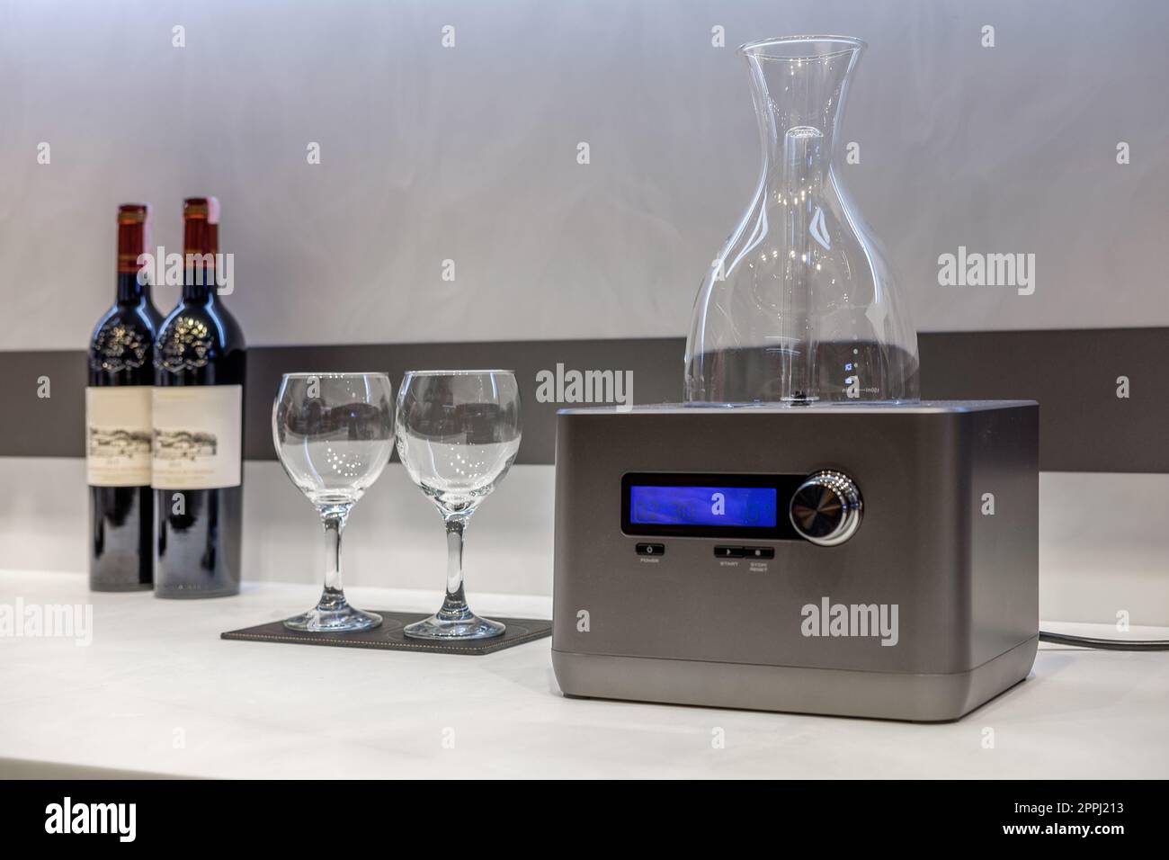 Home electric decanter with wine glasses and bottles near it Stock ...