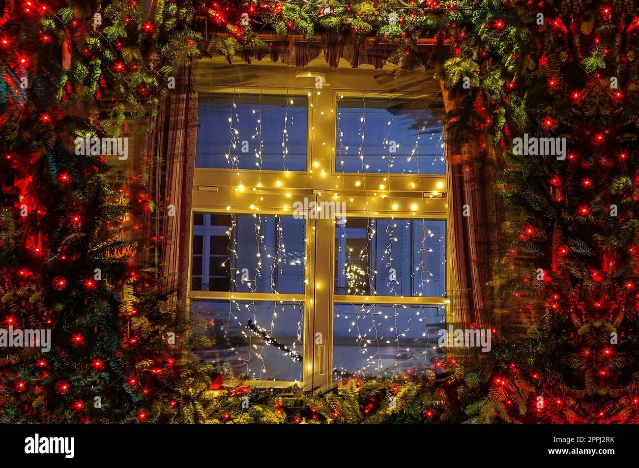 Christmas tree and fireplace seen through a wooden cabin window Stock ...